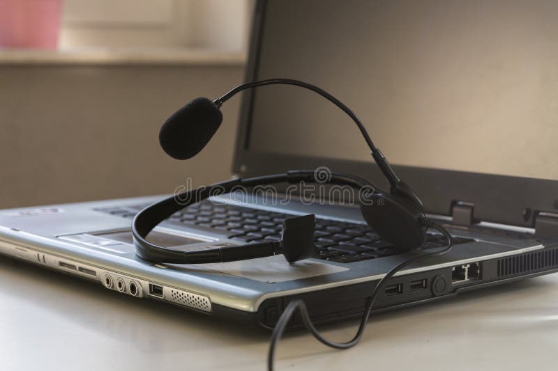 Notebook PC and Headset on a Table. Stock Image - Image of indoor ...