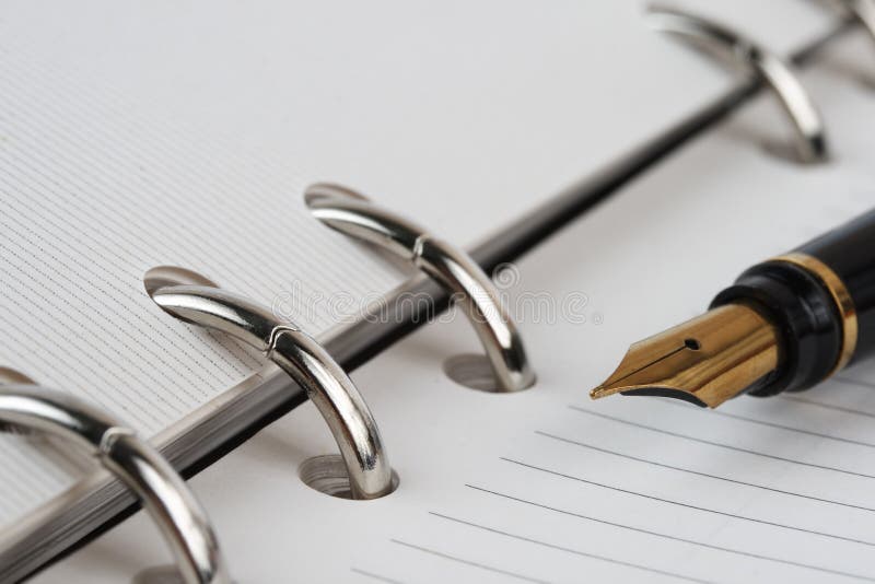 Notebook and a pen stock image. Image of binder, metallic - 7352699