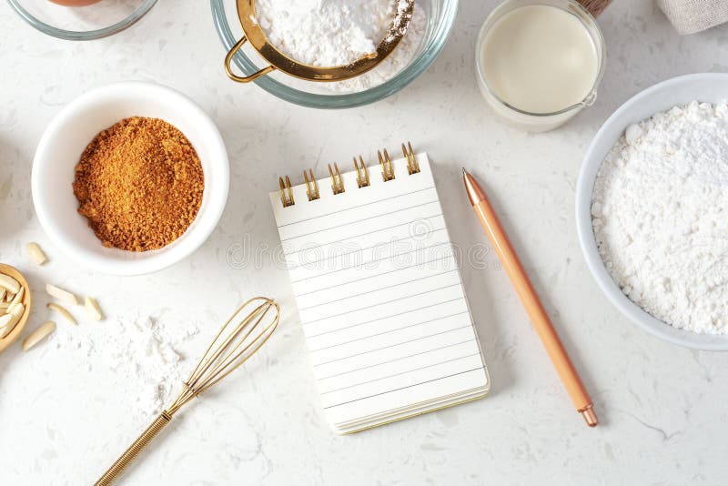 Notebook and Pen with Baking Ingredients, Flour, Brown Sugar, Milk on ...