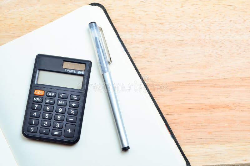 Notebook and Pen with Calculator on Wooden Table Stock Photo - Image of ...