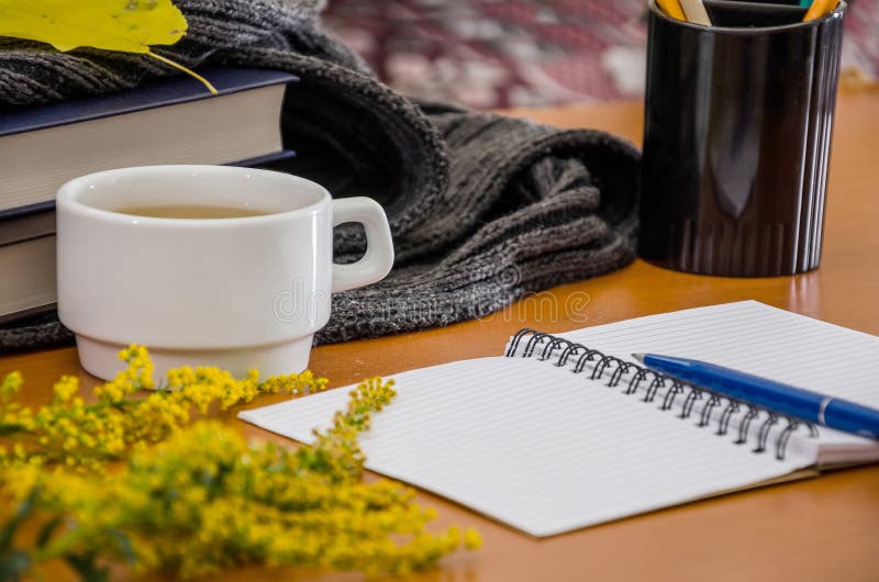 Notebook, Pen and Cup of Tea on the Table. Close-up. Stock Image ...