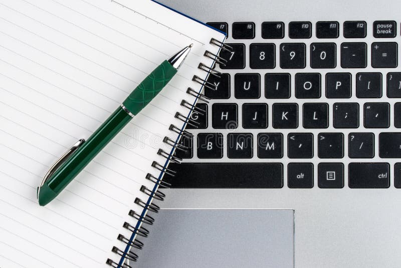 Notebook and Pen on the Laptop Keyboard, Close Up Stock Image - Image ...