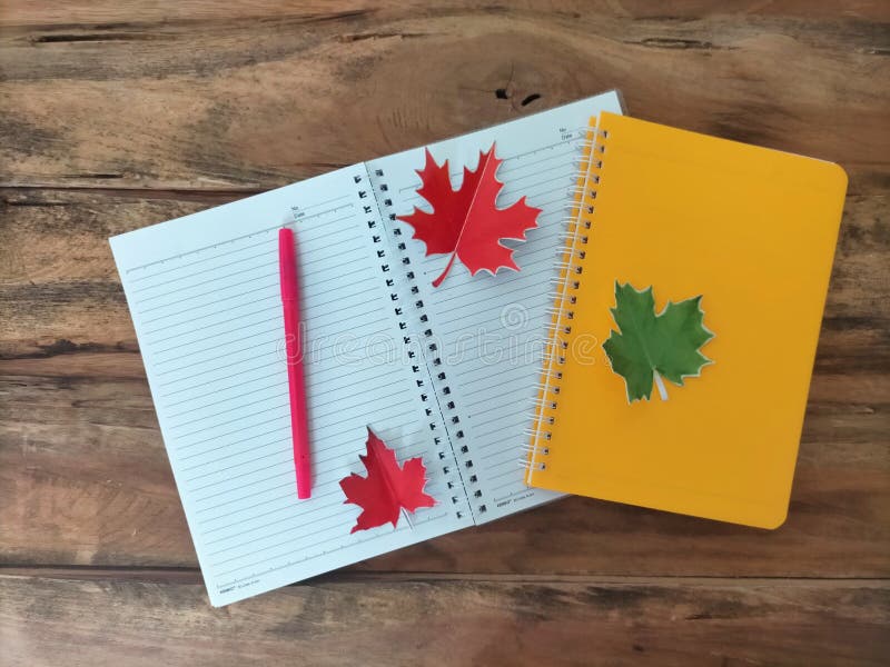 Notebook, Pen and Leaves of Maple on Wood Background Stock Image ...
