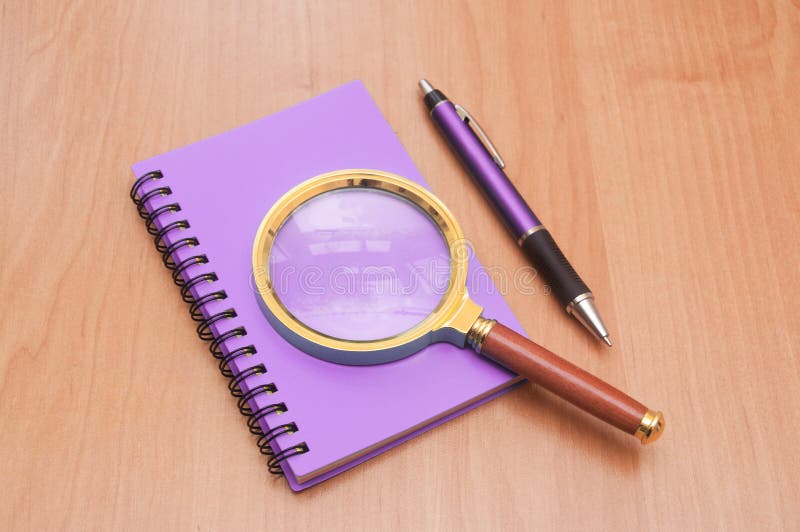Notebook Pen and Magnifying Glass Stock Photo - Image of violet, wooden ...
