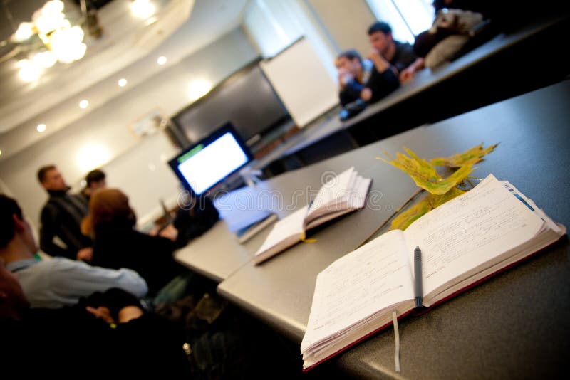 A Notebook and Pen of Teacher on Table and Students during Study or ...