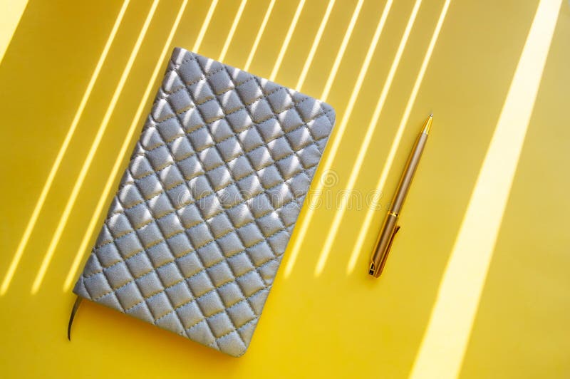 Notebook and Pen on a Yellow Background. View from Above. the Concept ...