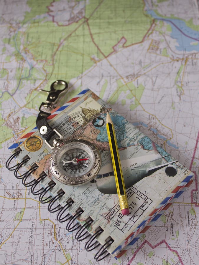 Notebook, Pencil and Compass Lying on a Topographic Map Stock Photo ...