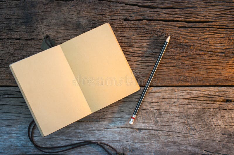 Notebook and Pencil on Old Wooden Table. Top View of Workplace W Stock ...