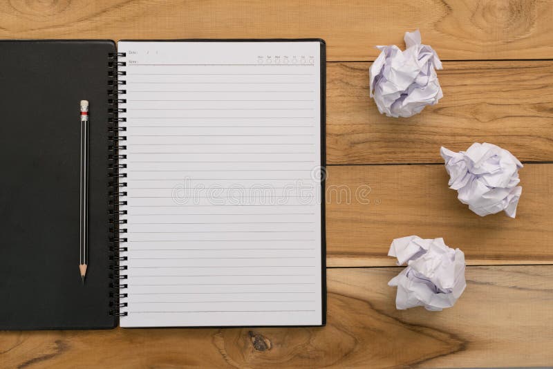 Notebook and Pencil with Sheets of Crumpled Paper on Old Wooden Stock ...