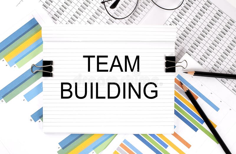 TEAM BUILDING Text on Notebook with Calculator on Diagram Background ...