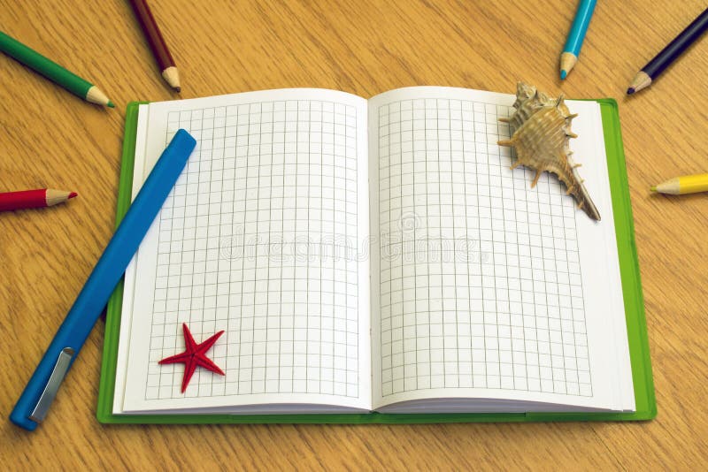 Notebook with Pencils and Pens on the Table Stock Image - Image of ...