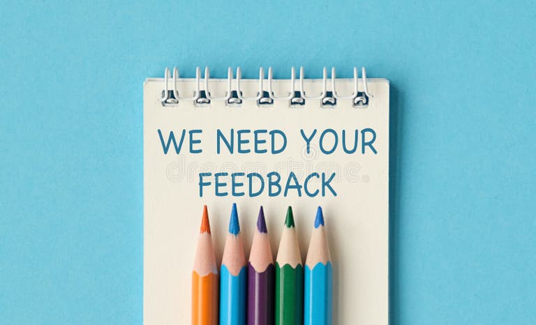 A Notebook with Pencils on it that Says we Need Your Feedback. Stock ...