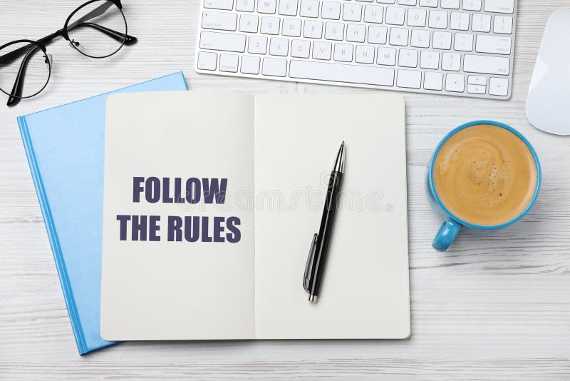 Notebook with Phrase Follow the Rules, Pen, Computer Keyboard and Cup ...