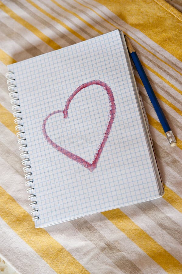 A Notebook with Pictured Heart on a Table Stock Image - Image of blank ...