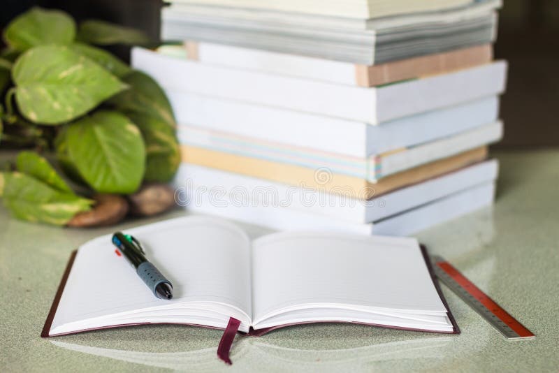 Notebook and pile of books stock image. Image of clean - 44215717