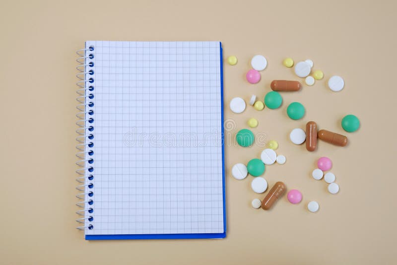 Notebook and Pills on a Beige Background. Health Notes Stock Image ...