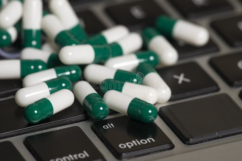 Notebook and pills stock photo. Image of laptop, notepad - 144625668