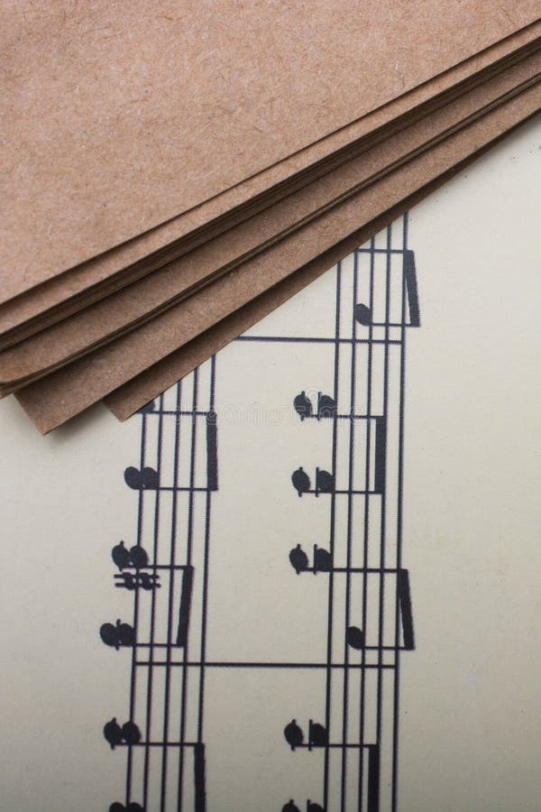 Notebook Placed on Paper with Musical Notes Stock Image - Image of note ...