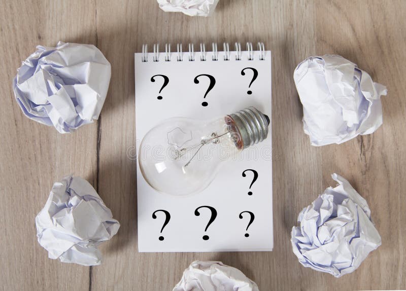 Notebook with Question Mark, Crumpled Papers and Bulb. Light Colored ...