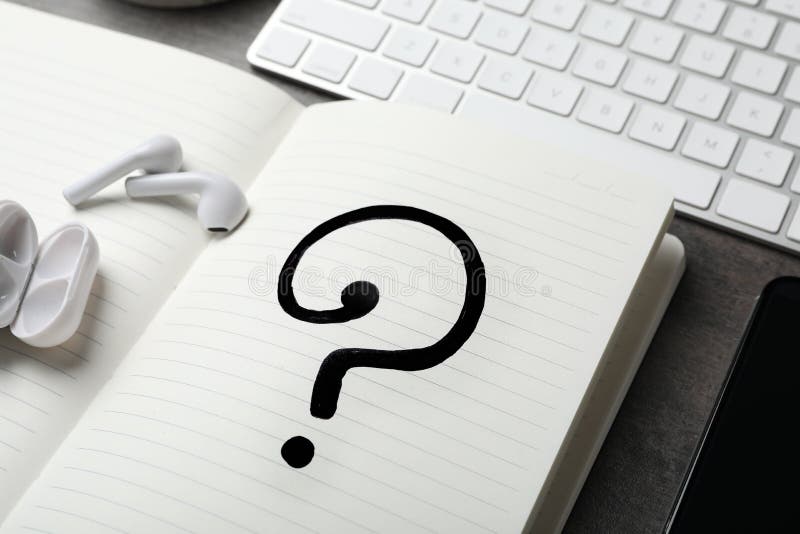 Notebook with Question Mark and Earphones on Table, Closeup Stock Photo ...