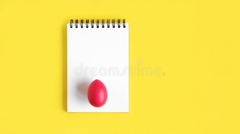 Notebook with Red Easter Egg. Spiral Notepad on Spring Yellow ...
