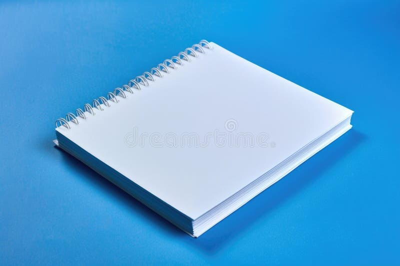 Notebook with Spiral Binding on a Blue Background, Great for Education ...
