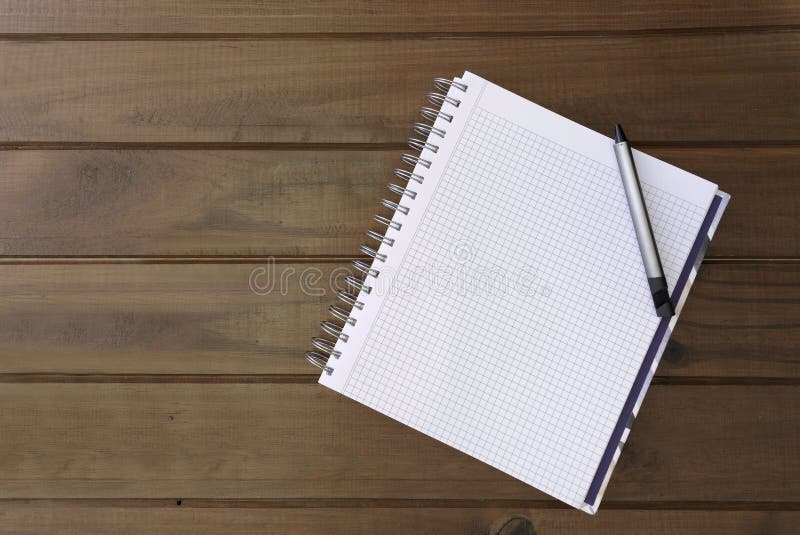 Notebook with Square Pages and Pen on a Wooden Table Stock Photo ...