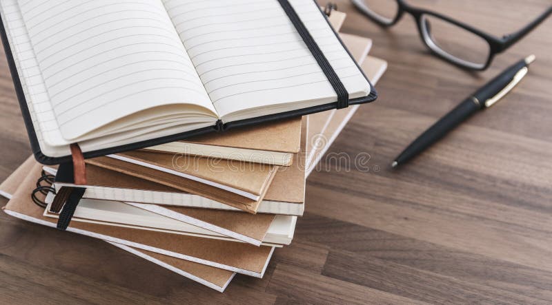 Notebook Stack on Wood Table Stock Image - Image of table, work: 85216469