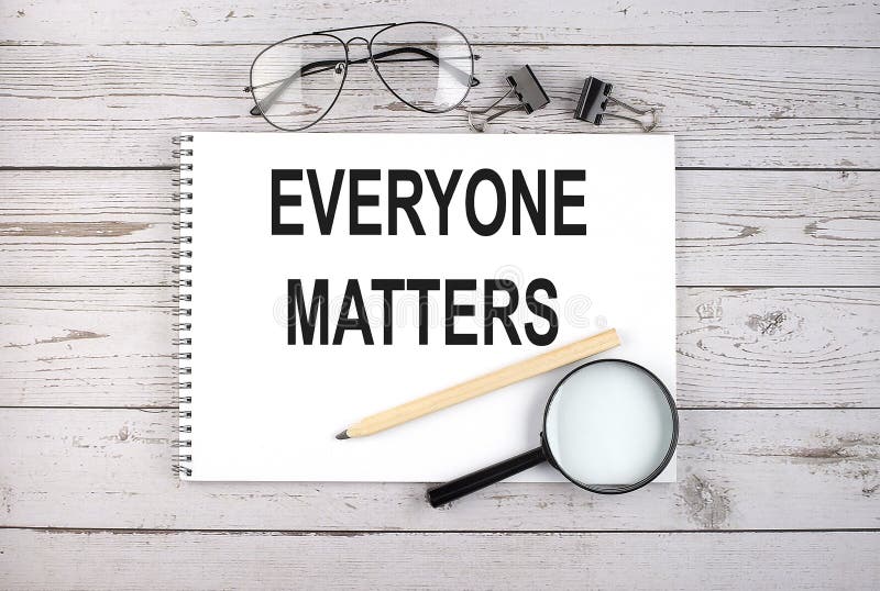 EVERYONE MATTERS Text on Sticker on the Yellow Notebook with Chart and ...