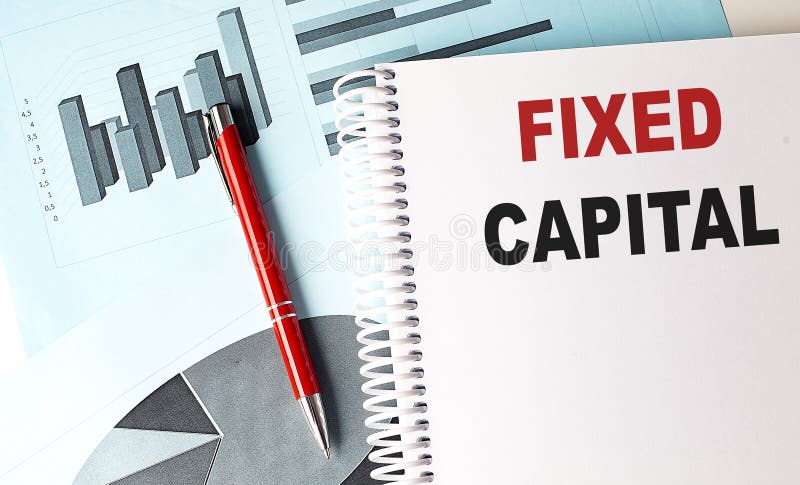 Notebook with the Text Fixed Capital on a White Cover, Placed on ...