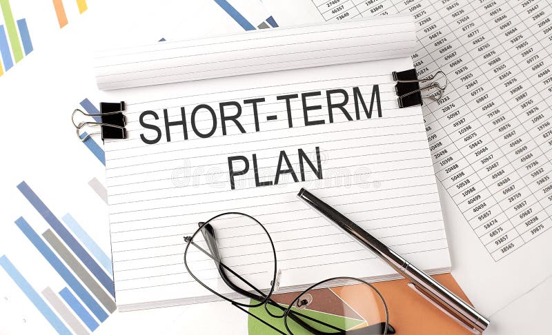 Notebook with Text SHORT-TERM PLAN on Table with Charts,pen and Glasses ...