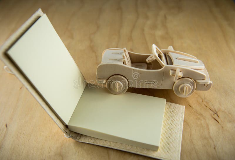 Notebook and toy car stock photo. Image of design, notebook - 73869694