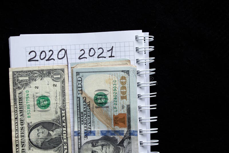 Notebook with Two Columns 2020 and 2021 Bundle of American Dollars on ...