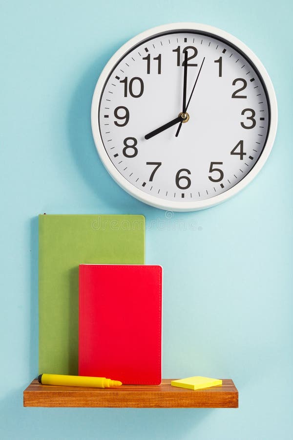 Notebook and Wall Clock on Shelf at Wall Background Stock Photo - Image ...
