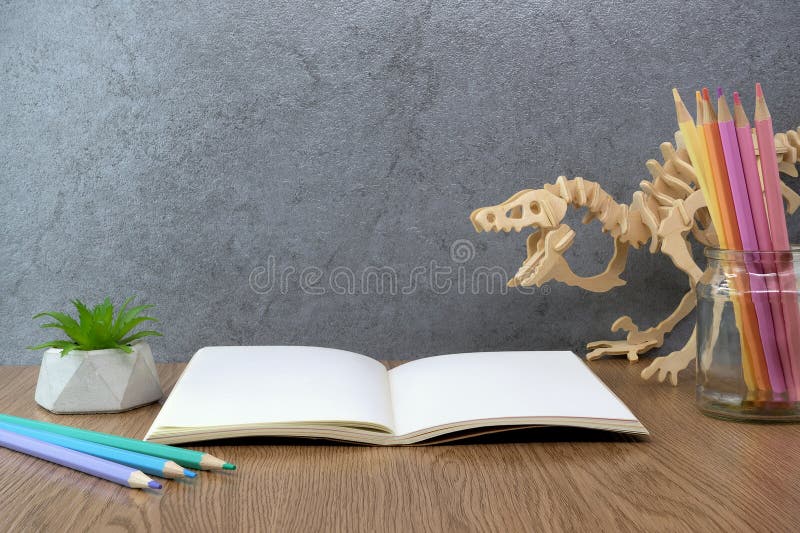 Notebook and Wood Dinosaur on Table. Work Desk Space Stock Image ...