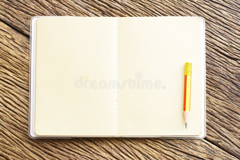 Notebook on wooden table stock photo. Image of blank - 54614460