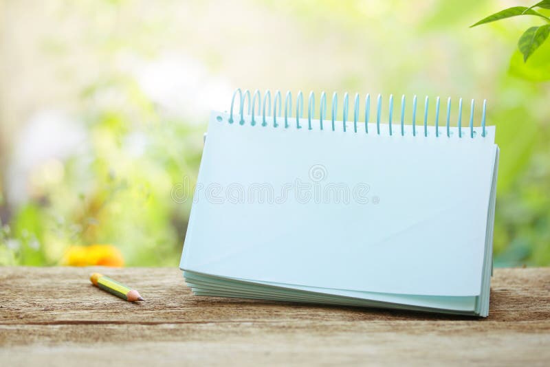 Notebook on wooden table stock image. Image of paper - 62622453