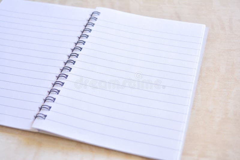 Notebook on wooden table stock photo. Image of brown - 103562654