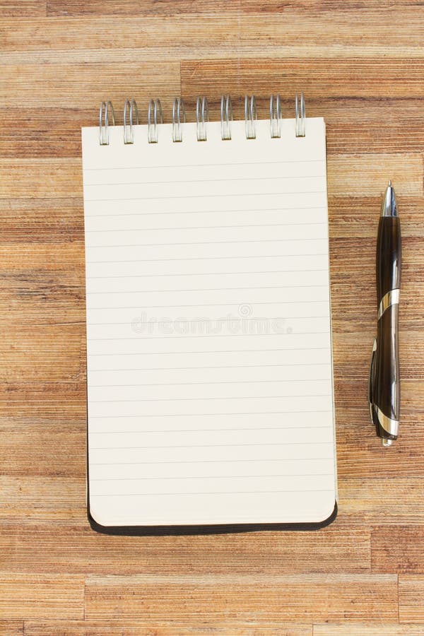 Notebook on wooden table stock image. Image of document - 46921221