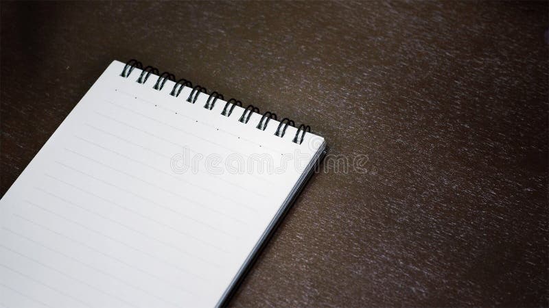 Notebook on a wooden table stock photo. Image of pencil - 66523760