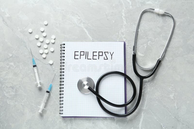Notebook with Word Epilepsy, Stethoscope, Pills and Syringes on Grey ...