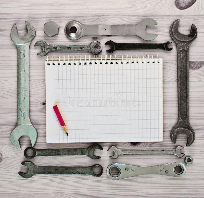 Notebook and wrench stock image. Image of metal, pencil - 40183985