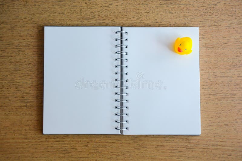 Notebook and Yellow Duck on Wood Desk Stock Image - Image of blank ...