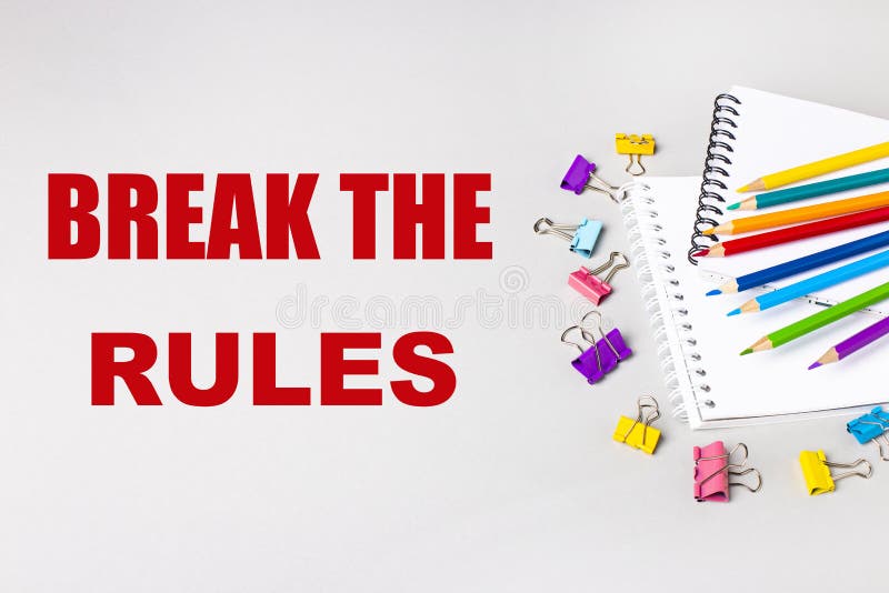 Notebooks, Colored Pencils and Paper Clips on a Light Gray Table. the ...