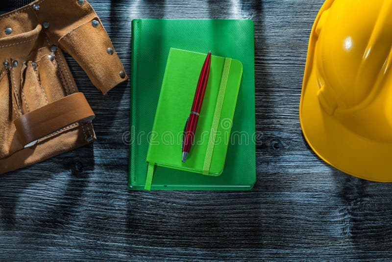 Notebooks Pen Hard Hat Tool Belt on Wooden Board Stock Photo - Image of ...