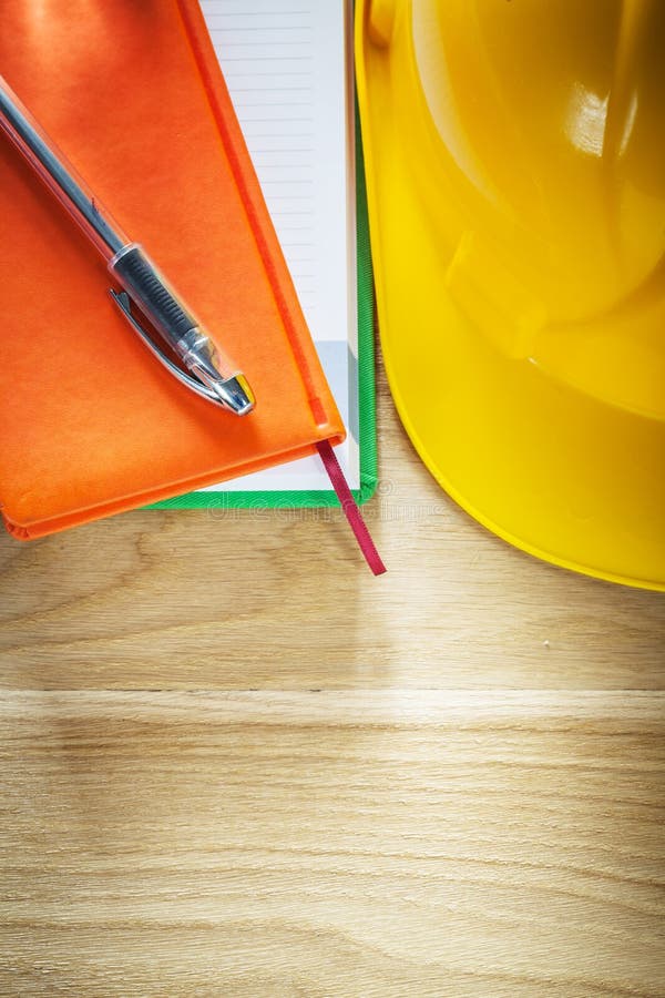 Notebooks Pen Hard Hat on Wooden Board Construction Concept Stock Image ...