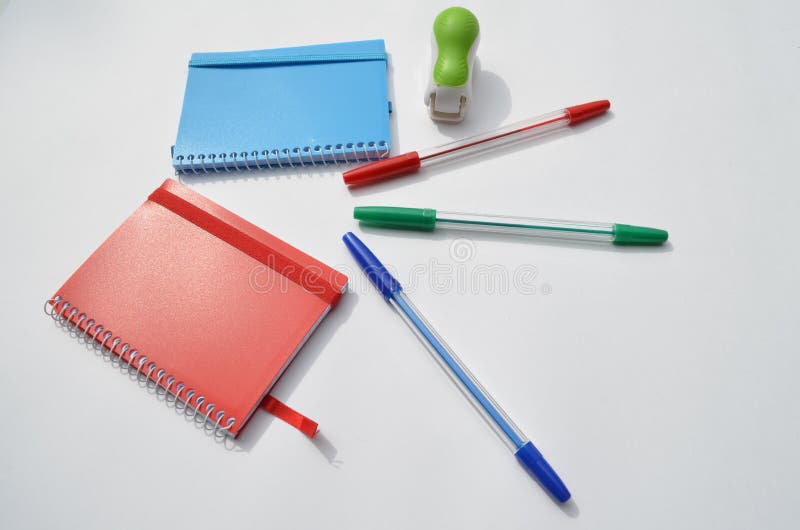 Notebooks, pens, a stapler stock image. Image of blue - 57307085