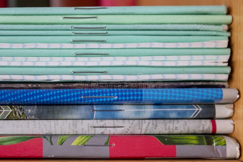 Notebooks are Stacked on the Shelf of the Cabinet Stock Photo - Image ...