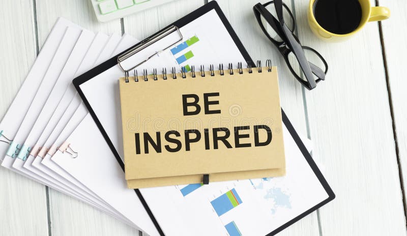 Notepad with Be Inspired Text on the Office Table Stock Photo - Image ...