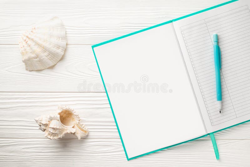 Notepad Blank and Automatic Pencil on a White Wooden Table with Shells ...